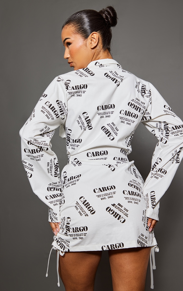 Cream Cargo Print Ruched Zip Through Bodycon Dress | PrettyLittleThing