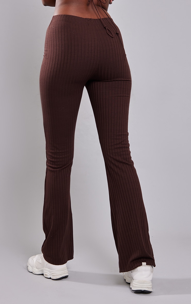 Chocolate Brown Rib Skinny Flared Trousers | PrettyLittleThing CA