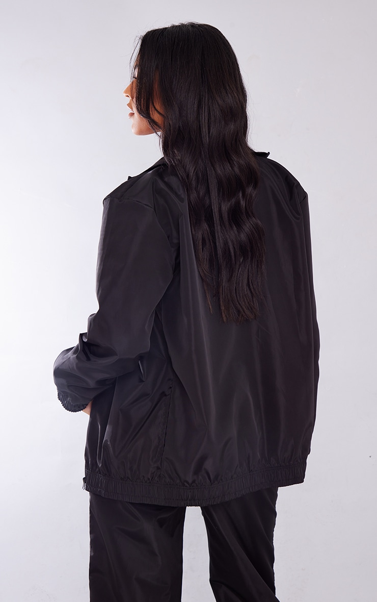 Tall Black Shell Pipe Detail Wind Breaker Jacket | PrettyLittleThing IE