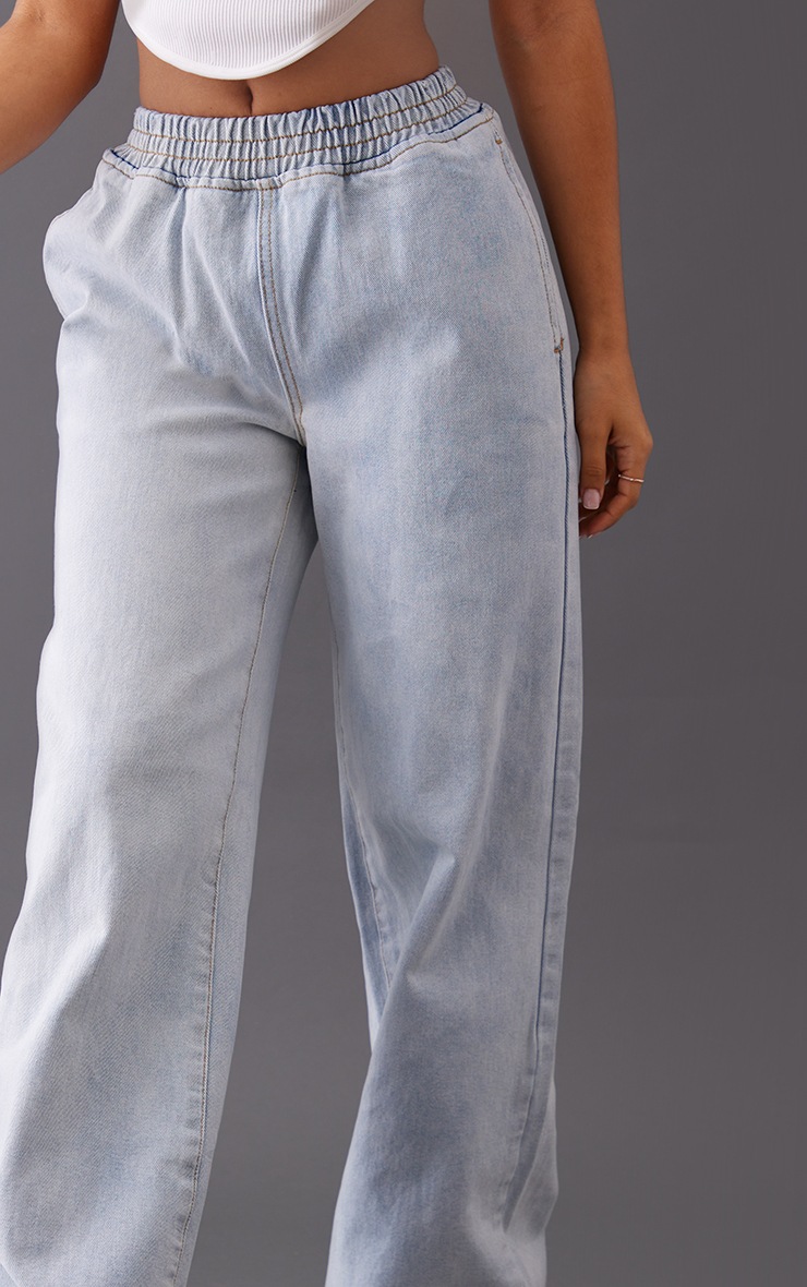 Petite Light Blue Wash Elasticated Wide Leg Jeans | PrettyLittleThing