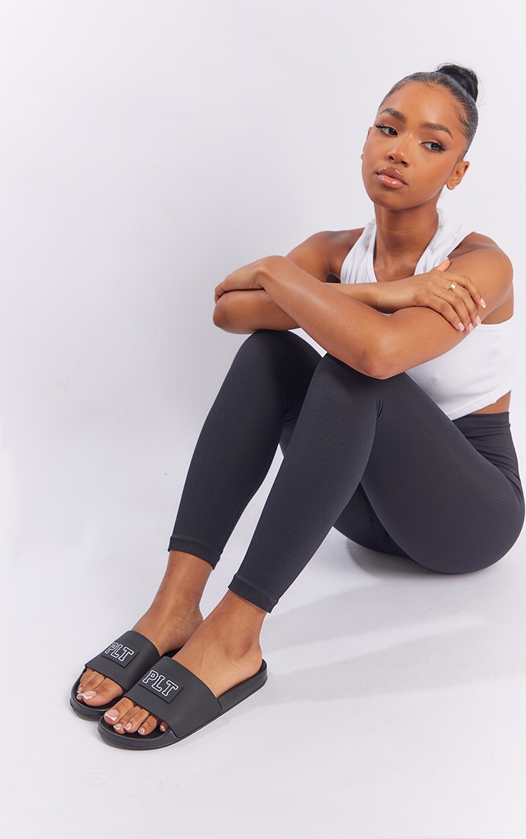Black Pu Round Toe Plt Square Badge Sliders | PrettyLittleThing
