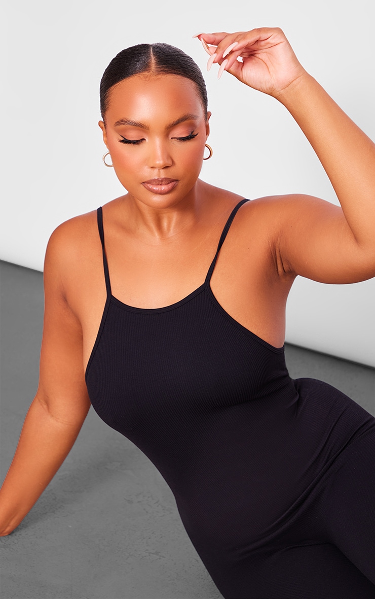 Plus Black Snatched Rib Strappy Racer Neck Jumpsuit | PrettyLittleThing USA