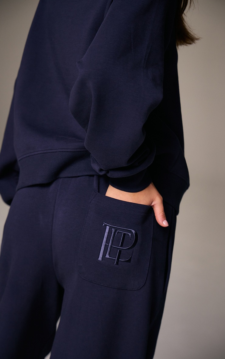 Navy Embroidered Interlock Wide Leg Track Pant | Athleisure | PLT AUS