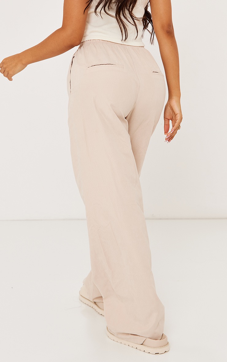 Petite Beige Peach Skin Cargo Trousers | Petite | PrettyLittleThing