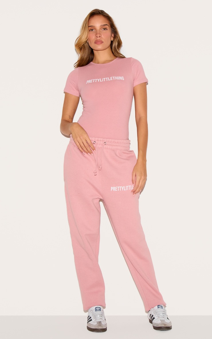 PLT Light Pink Logo Short Sleeve Bodysuit | Sweat | PrettyLittleThing