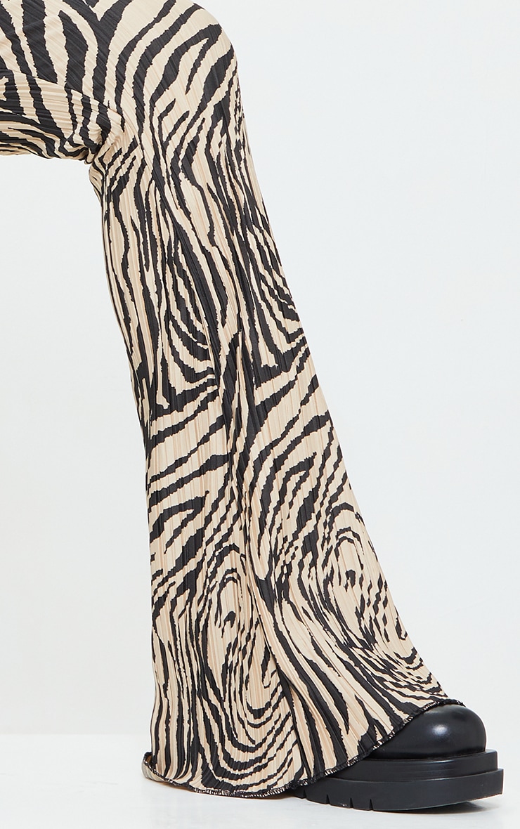 Stone Zebra Print Plisse Flared Pants | PrettyLittleThing USA