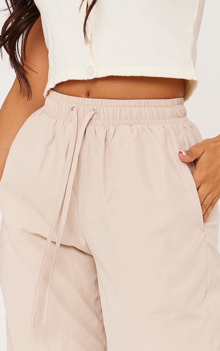 Petite Beige Peach Skin Cargo Trousers | Petite | PrettyLittleThing