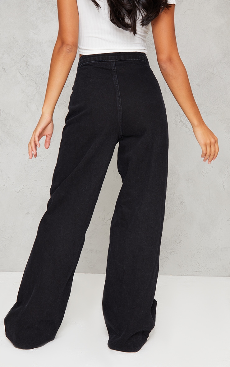 Petite Black Cut Out Front Strap Wide Leg Jeans | PrettyLittleThing