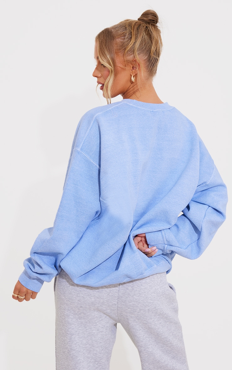 Washed Blue Worldwide Sweatshirt | Tops | PrettyLittleThing AUS