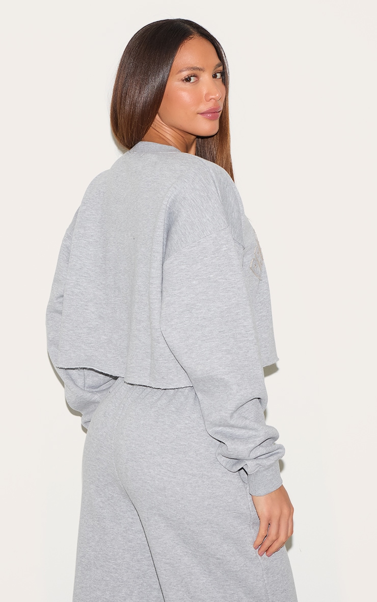 PLT Tall Grey Marl Varsity Crop Sweatshirt | Tall | PrettyLittleThing USA