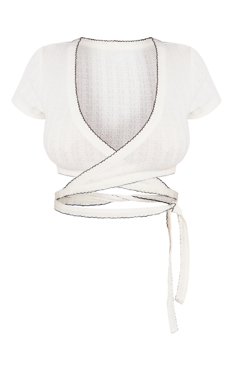 Cream Texured Rib Tie Front Crop Top | Tops | PrettyLittleThing