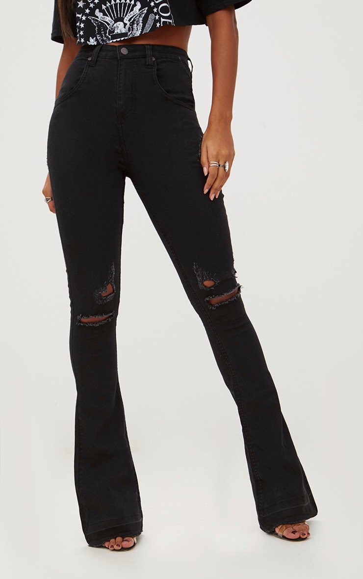 Black Distressed Knee Flare Jean | Denim | PrettyLittleThing