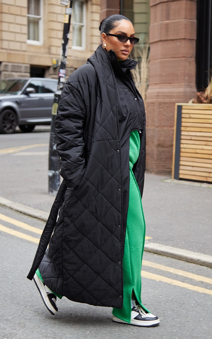 Plus Black Quilted Layered Maxi Tie Waist Puffer | PrettyLittleThing