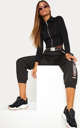 Black Rib Zip Up Top | Tops | PrettyLittleThing USA