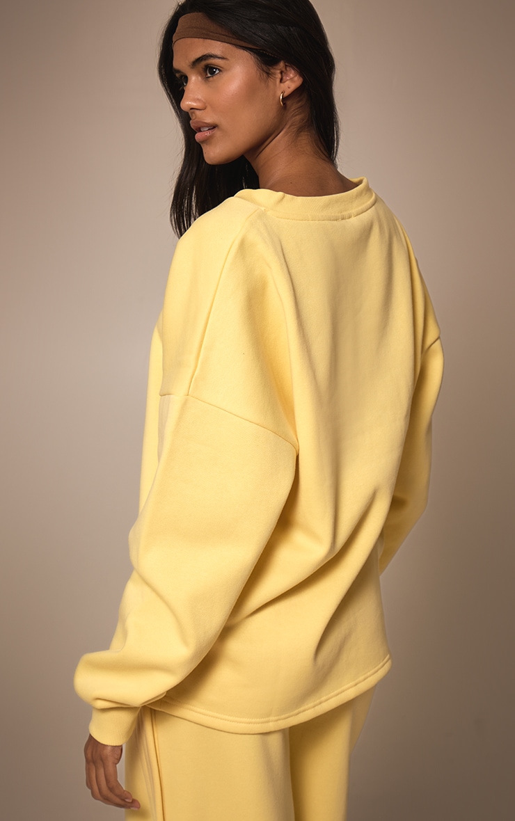 Butter Yellow Oversized V Neck Sweatshirt | Athleisure | PrettyLittleThing USA