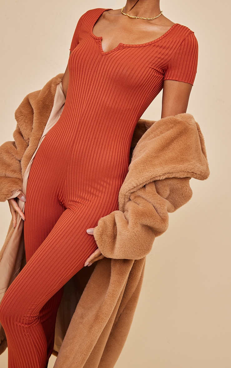 Rust Cap Sleeve V Neck Rib Flared Jumpsuit | PrettyLittleThing