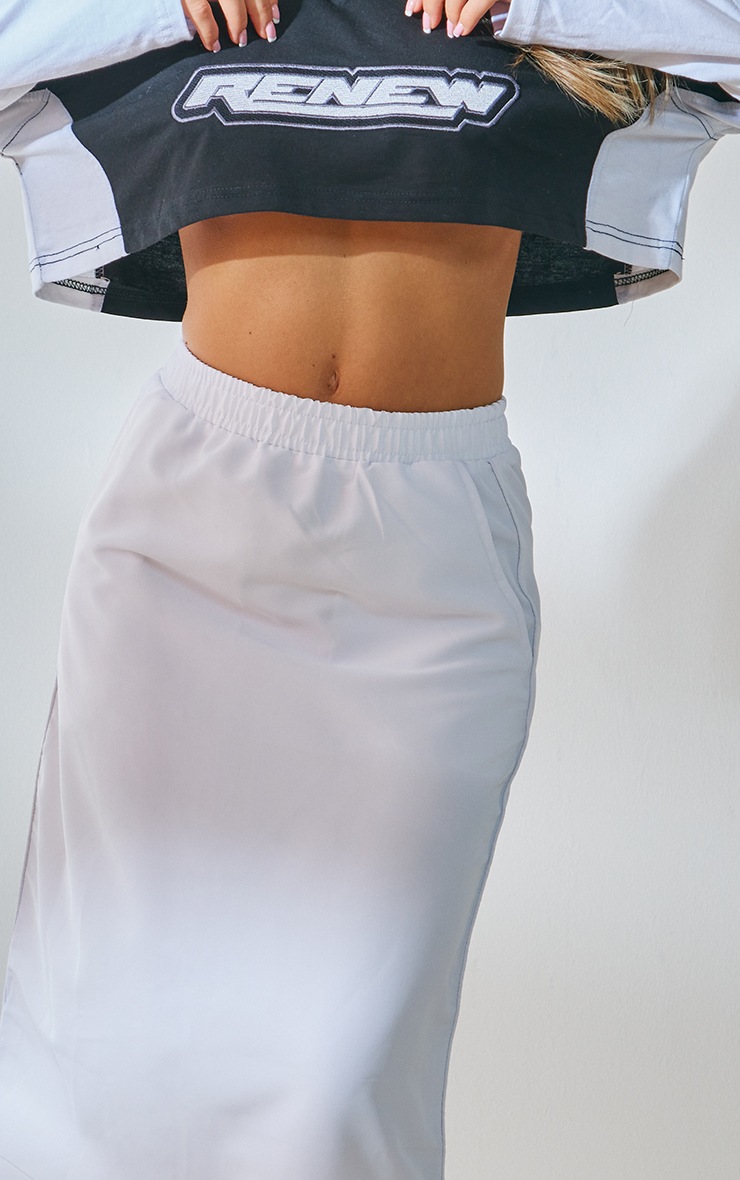 Jupe mi-longue blanche nylon à coutures surjetées contrastantes ...