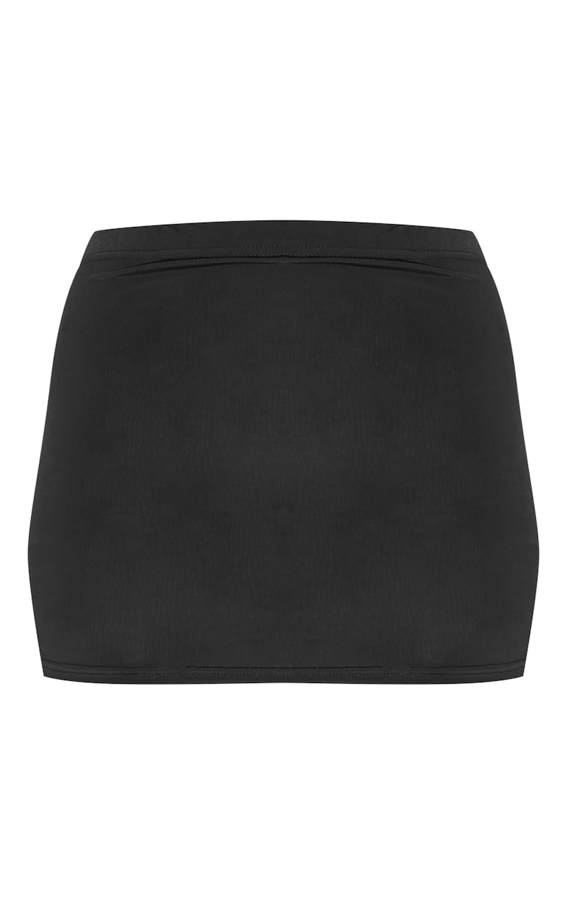 Black Slinky Basic Low Rise Mini Skort | Bottoms | PrettyLittleThing IRE