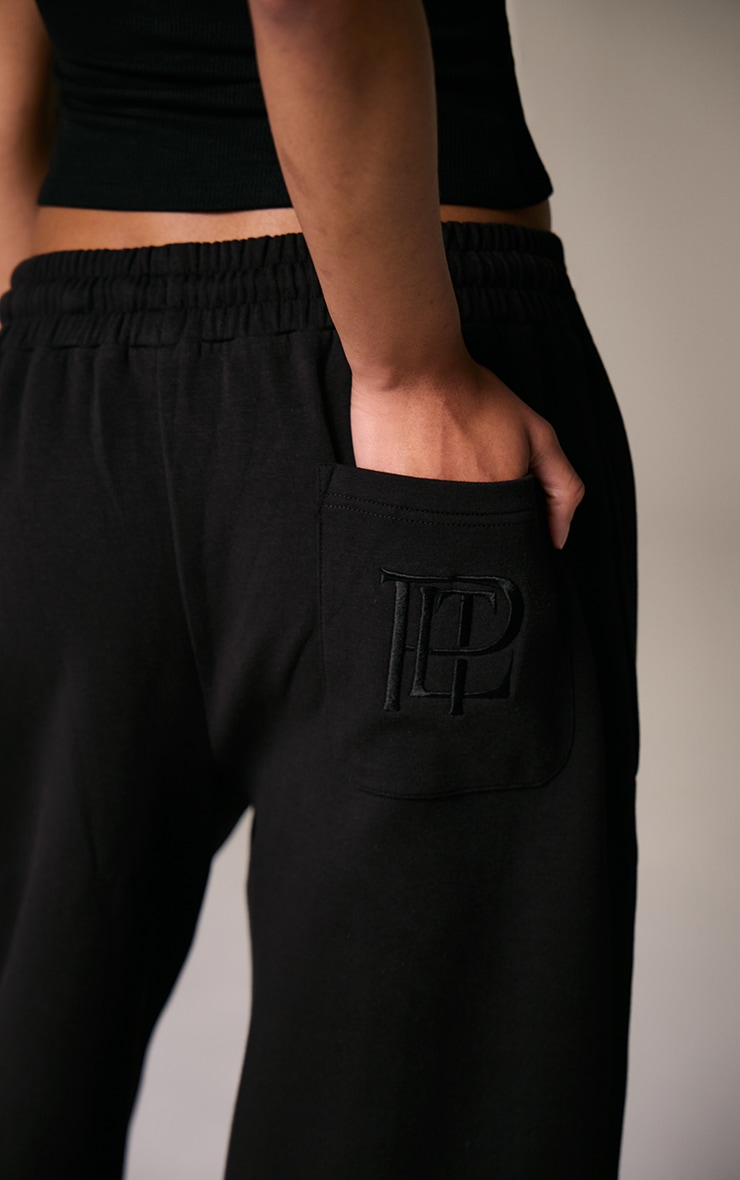 Black Embroidered Interlock Wide Leg Jogger | Athleisure | PLT