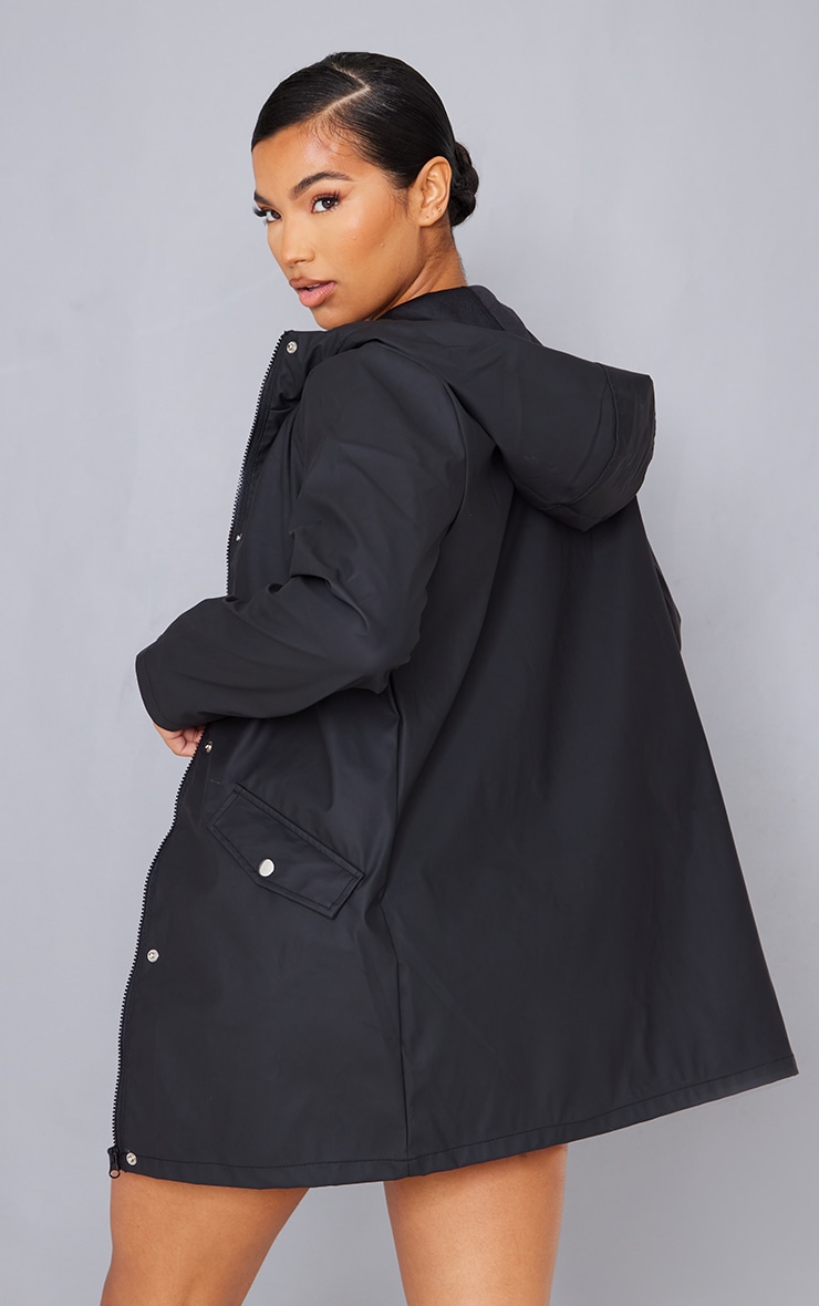 Black Pocket Front Waterproof Rain Mac | PrettyLittleThing