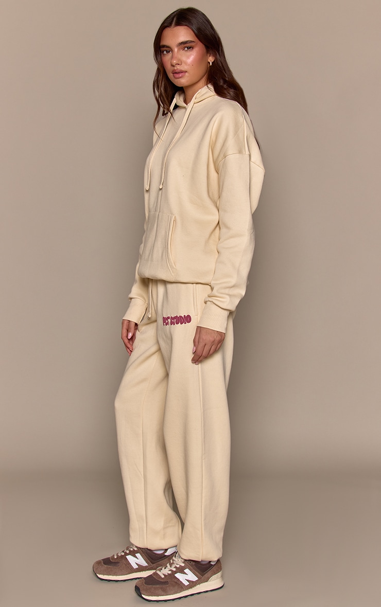 Butter Cream PLT Studio Print Oversized Hoodie | Athleisure | PLT UAE