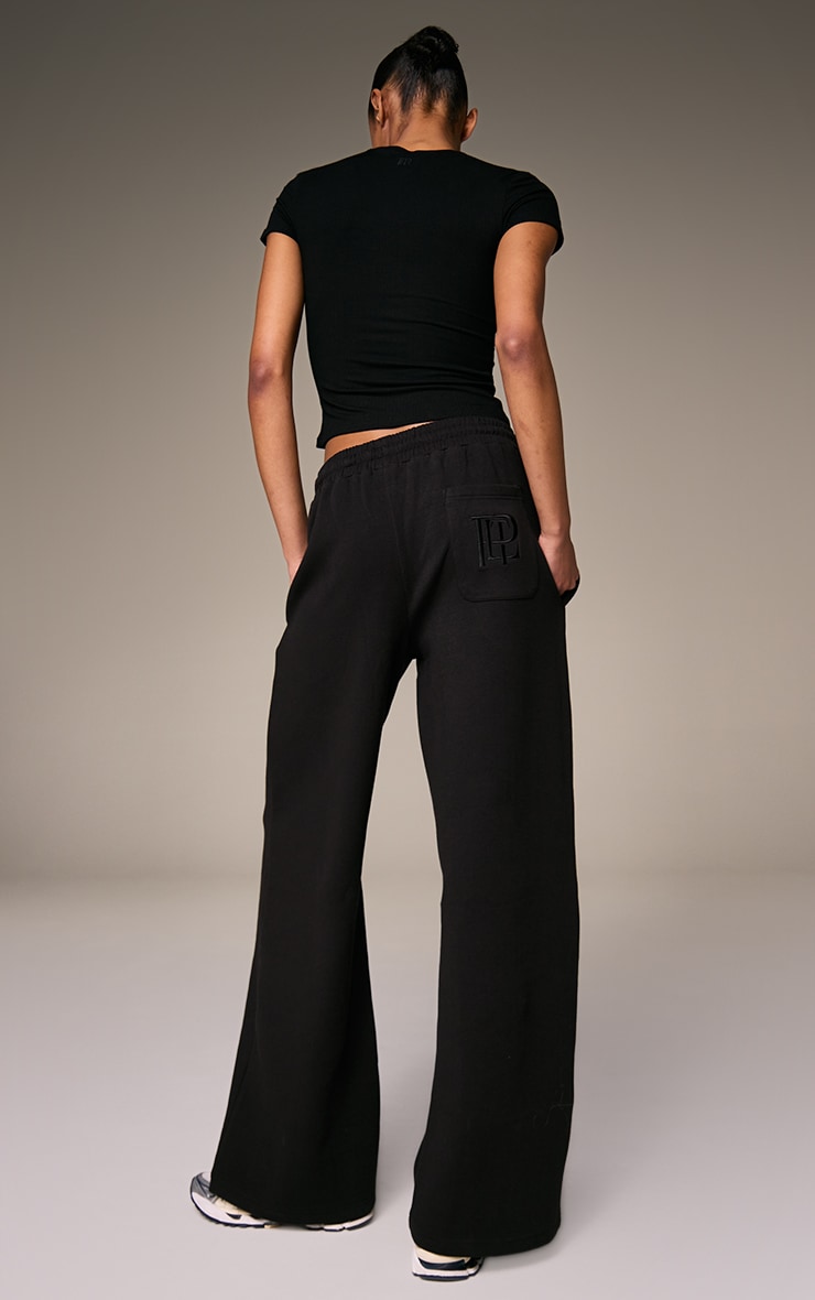 Black Embroidered Interlock Wide Leg Jogger | Athleisure | PLT