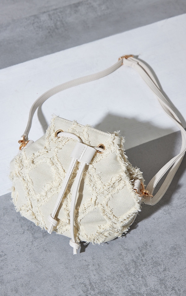 Cream Frayed Denim Drawstring Cross Body | Accessories | PLT