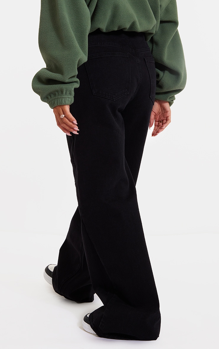 Jean large noir délavé à bande sur la taille élimée | PrettyLittleThing FR