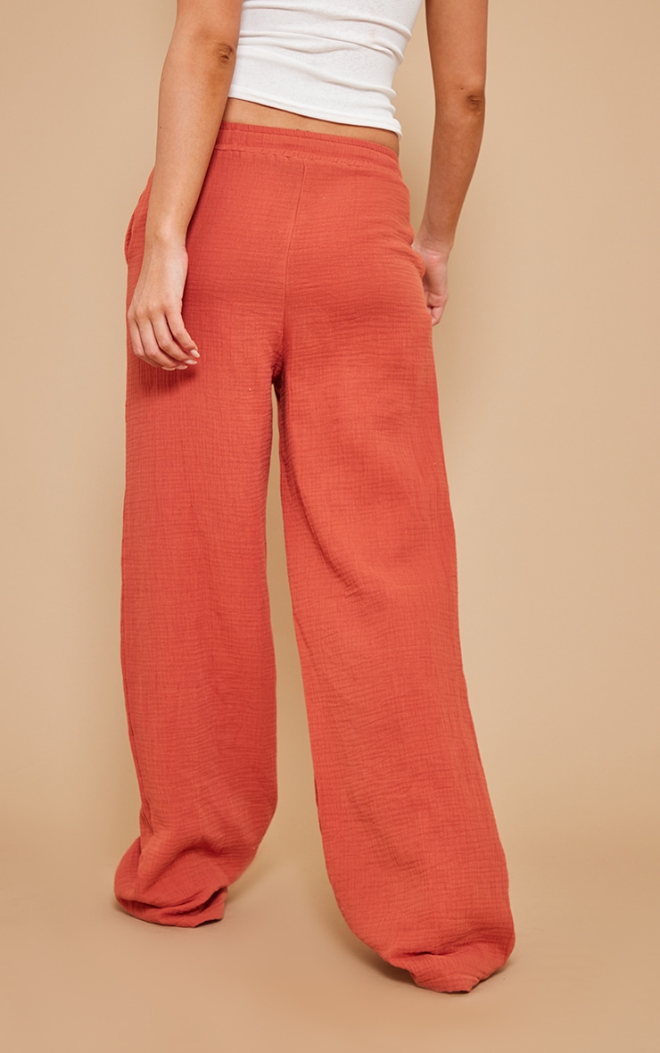 Rust Textured Cheesecloth Drawstring Waist Trousers | PrettyLittleThing