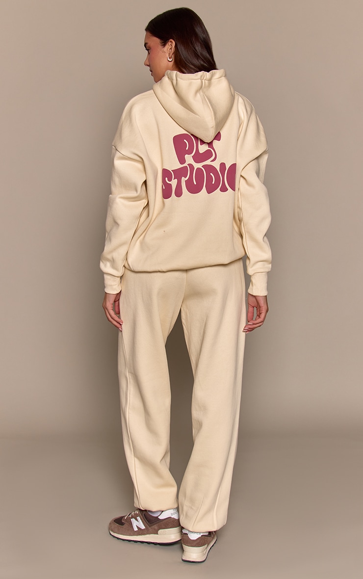 Butter Cream PLT Studio Print Cuffed Joggers | Athleisure | PLT UAE