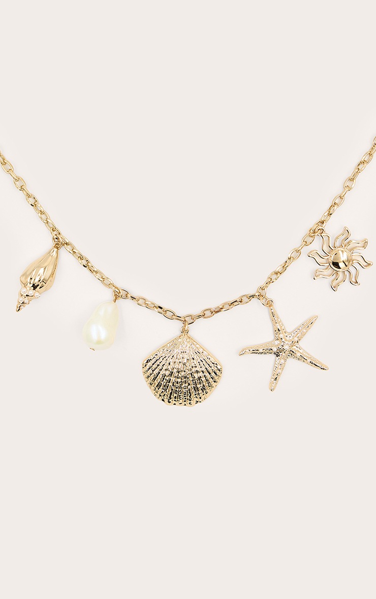 Gold Assorted Shell Charm Necklace | Accessories | PrettyLittleThing USA