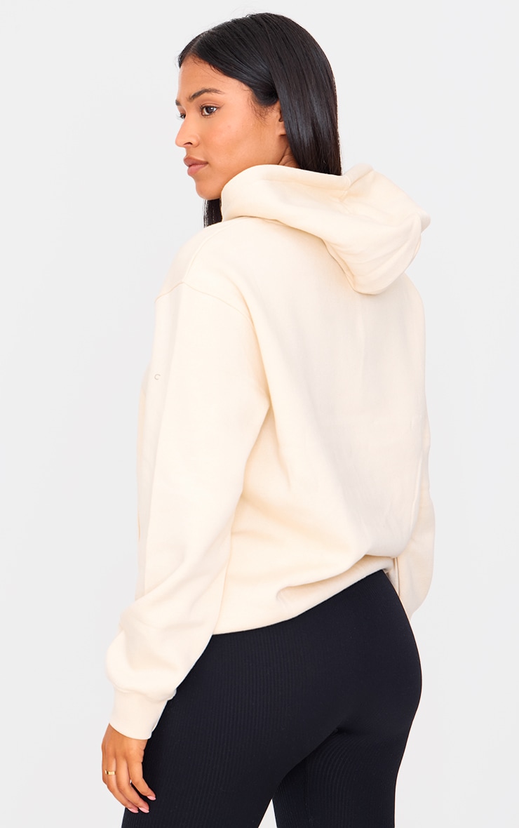 PLT Tall Cream Oversized Badge Detail Hoodie | Tall | PrettyLittleThing USA