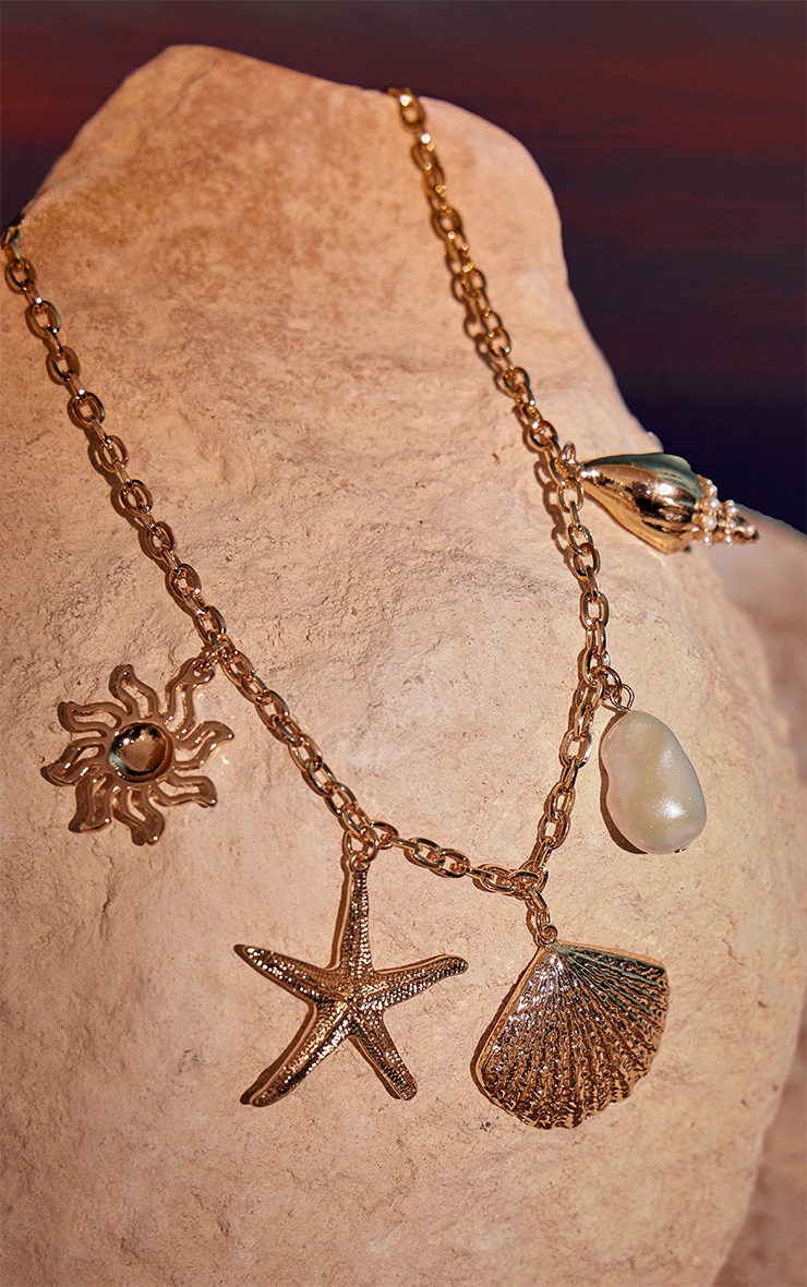 Gold Assorted Shell Charm Necklace | Accessories | PrettyLittleThing USA