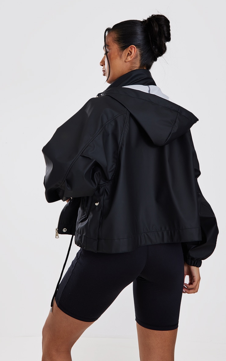 Black Rubberised Hooded Drawstring Jacket | PrettyLittleThing