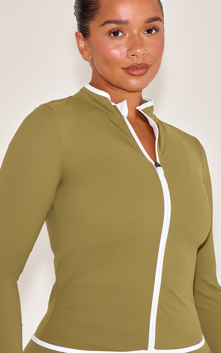 SHAPE OLIVE ACTIVE CONTRAST BINDING ZIP UP JACKET | Shape | PrettyLittleThing USA