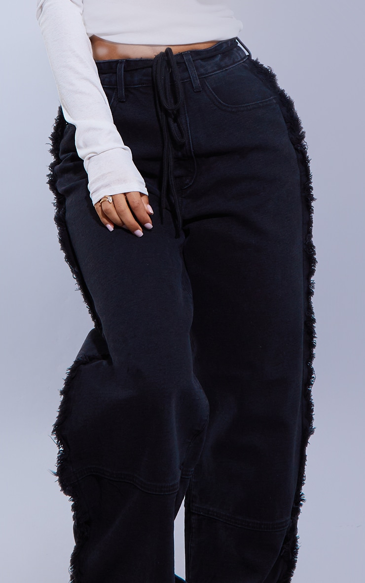 Petite Jean élimé noir délavé noué devant | PrettyLittleThing FR