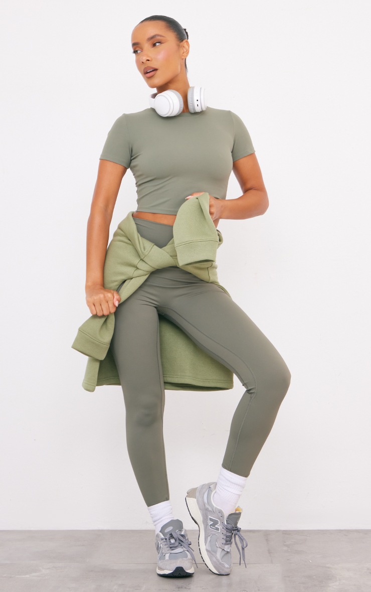 Olive Sculpt Short Sleeve Crop Gym Top | PrettyLittleThing USA