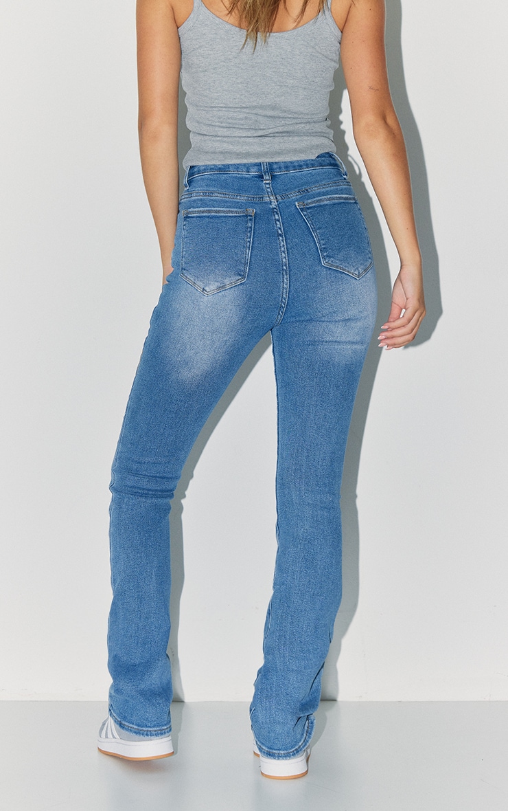 Mid Blue Wash Stretch Mid Rise Slim Flared Jeans | PrettyLittleThing