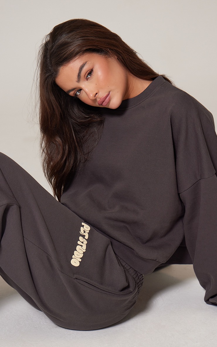 PLT Charcoal Premium Studio Print Boxy Sweatshirt | Athleisure | PrettyLittleThing USA