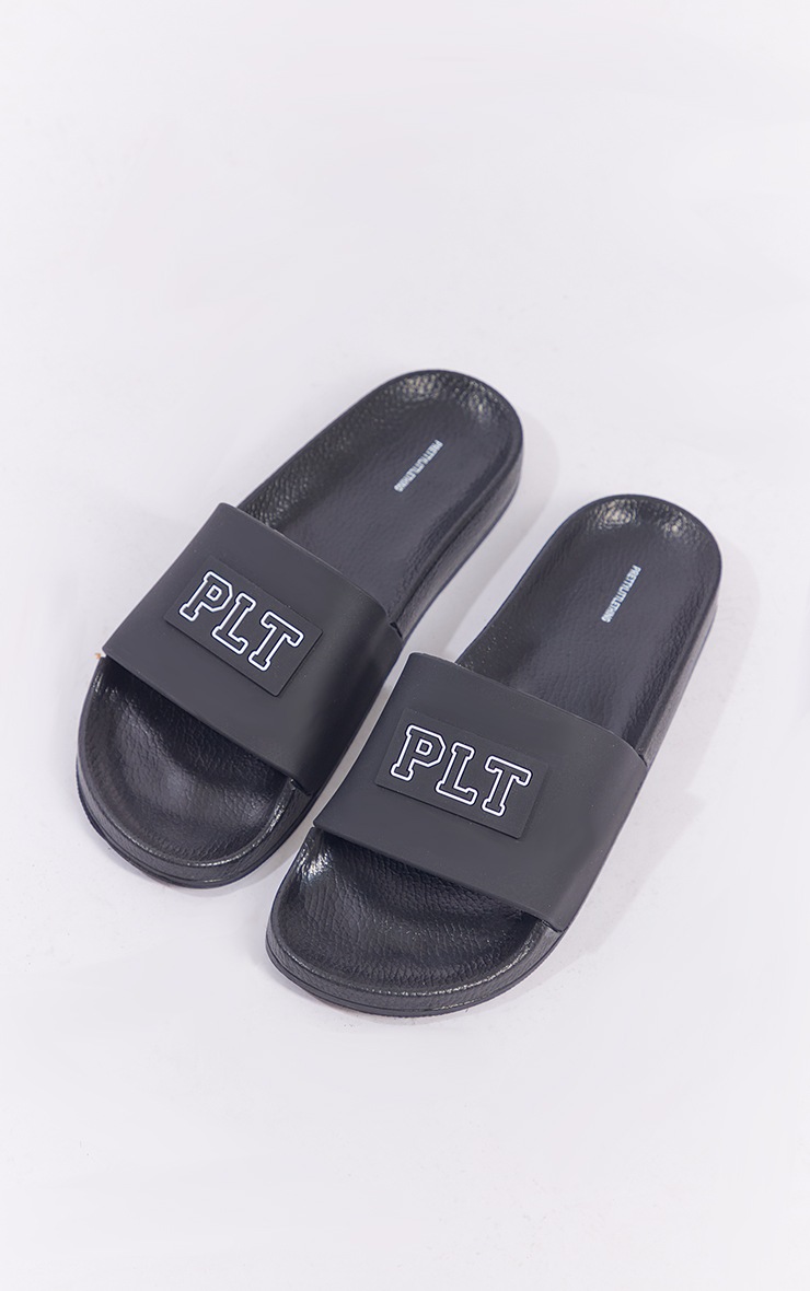 Black Pu Round Toe Plt Square Badge Sliders | PrettyLittleThing