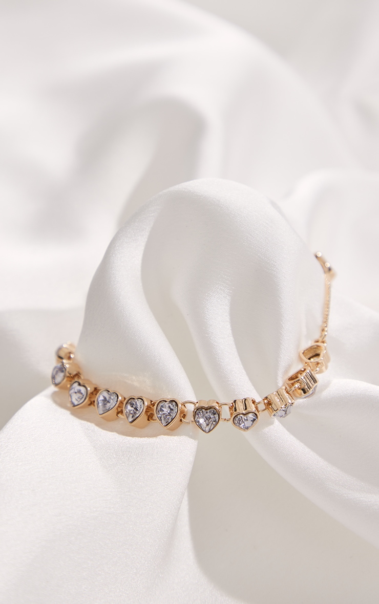 Gold Heart Jewelled Pully Bracelet | PrettyLittleThing