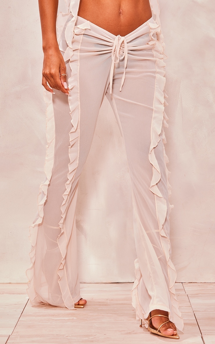 Cream Chiffon Ruffle Dipped Waist Flared Pants | PrettyLittleThing USA