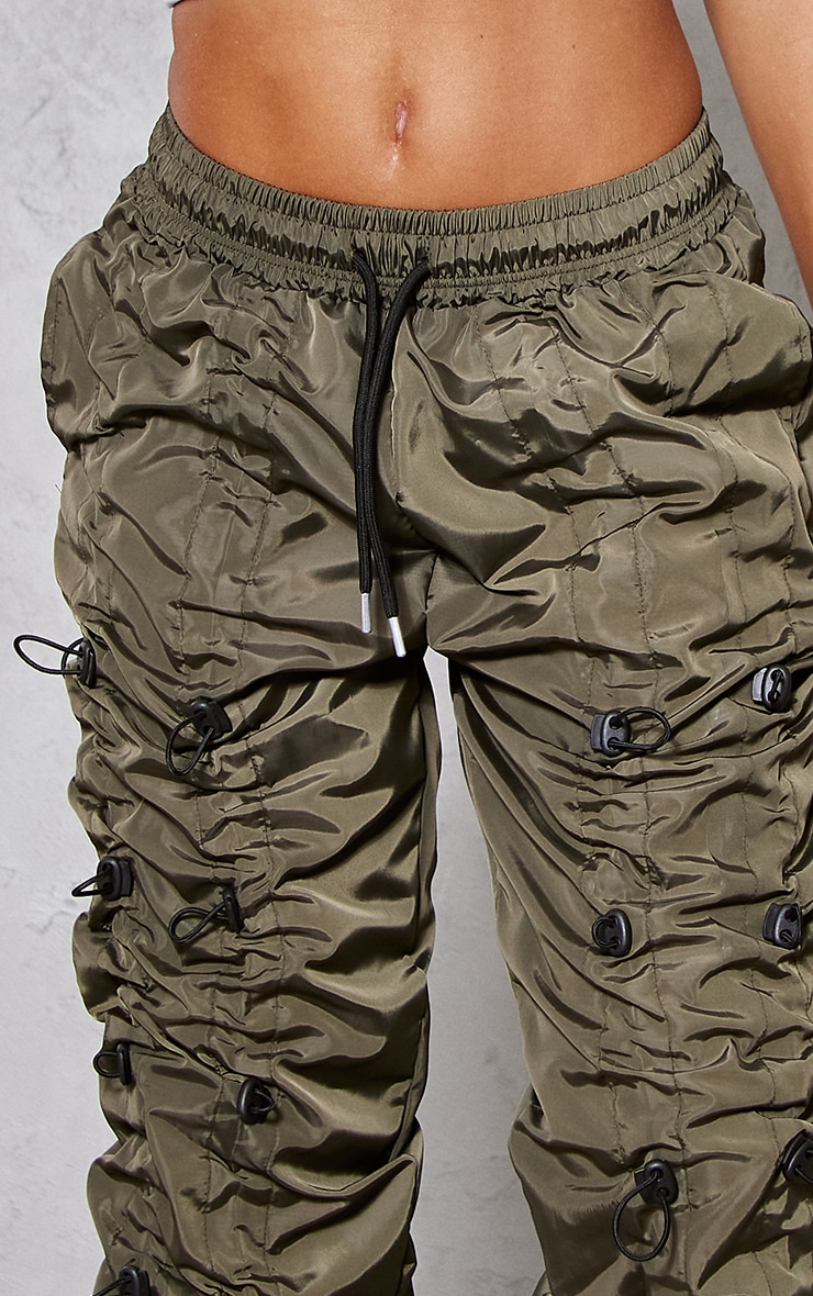 Khaki Shell Toggle Detail Straight Leg Trousers | PrettyLittleThing USA