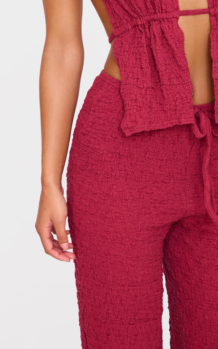 Burgundy Wide Leg Textured Trousers | Co-ords | PrettyLittleThing