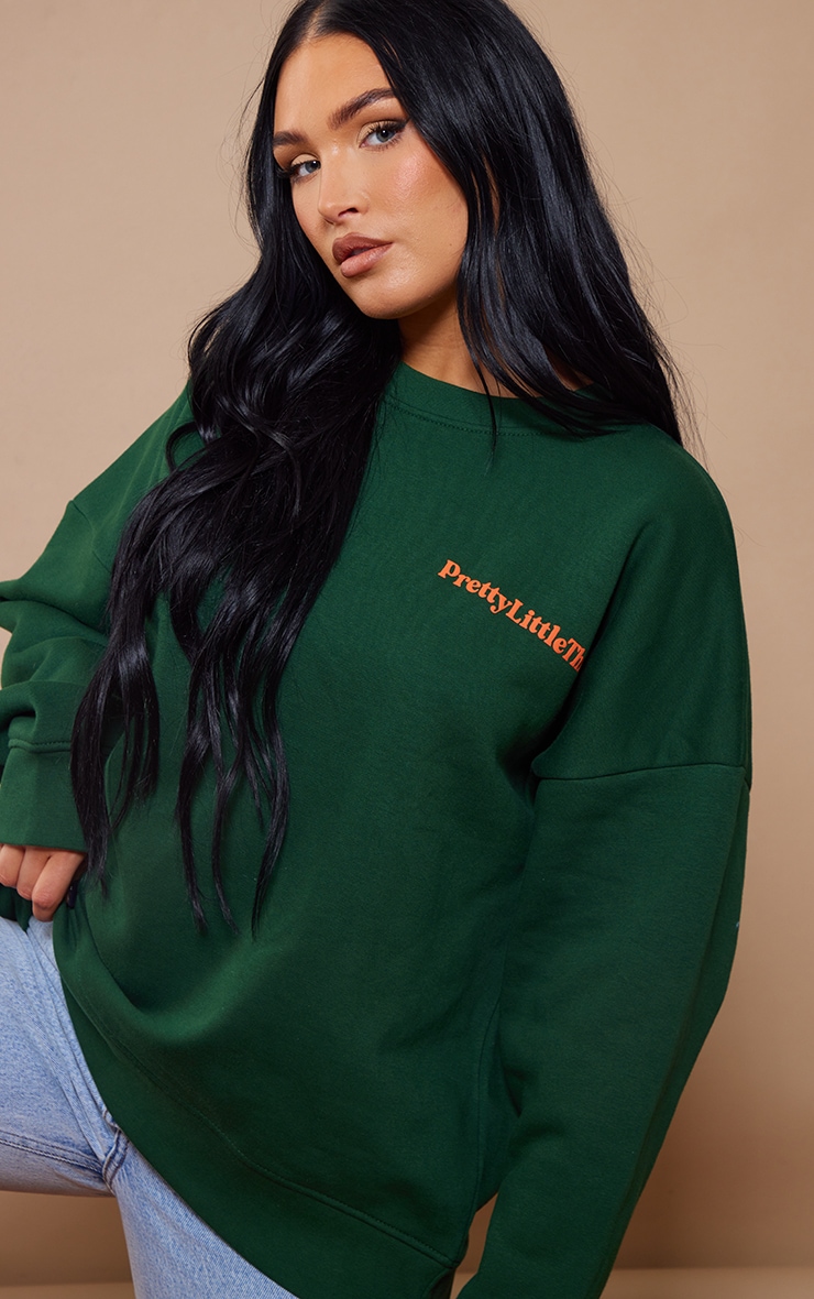PLT Label Forest Green Printed Sweatshirt | PrettyLittleThing