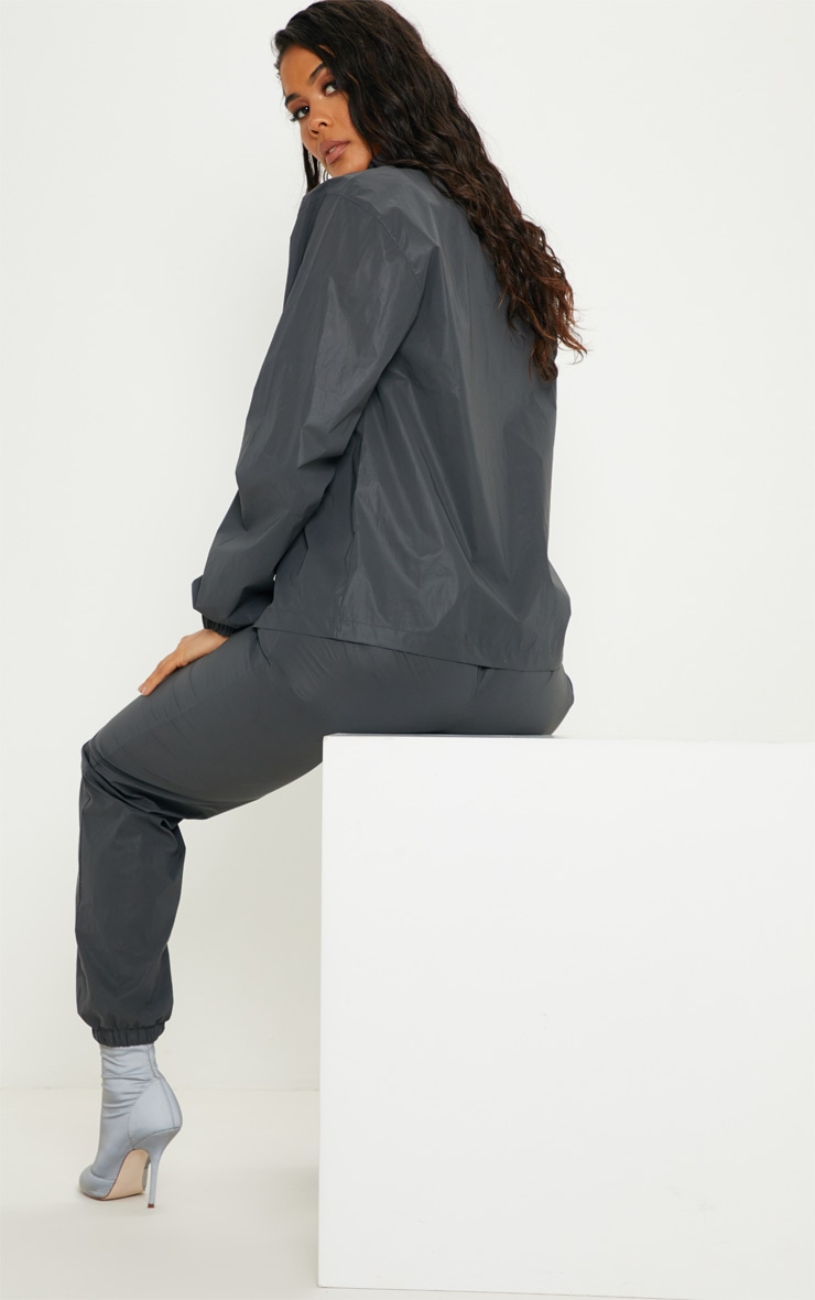 Charcoal Shell Tracksuit Zip Up Top | Tops | PrettyLittleThing USA