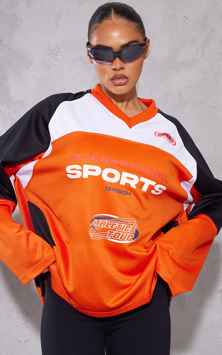 Prettylittlething Orange Sport Printed Rugby Shirt | PrettyLittleThing USA