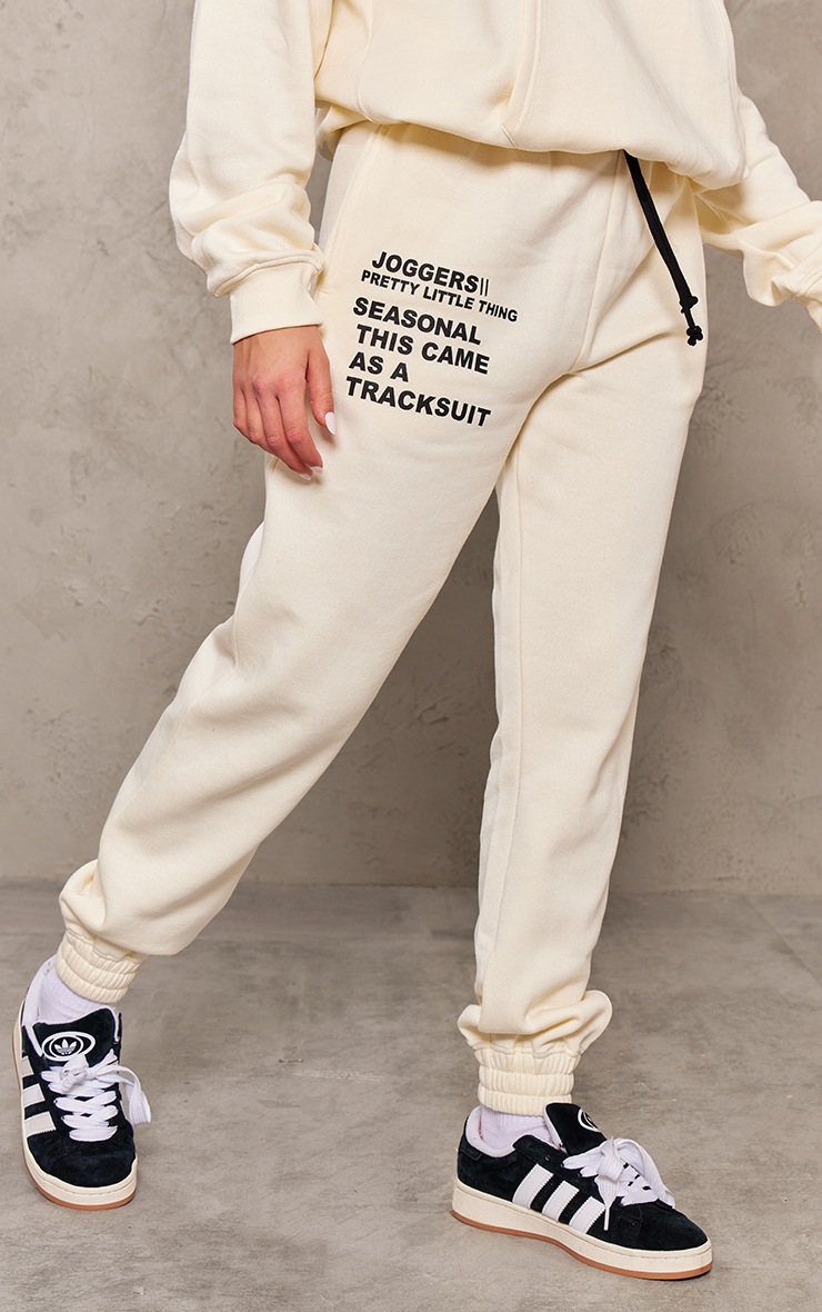 PLT Logo Cream Graphic Print Sweatpants | Sweat | PrettyLittleThing USA