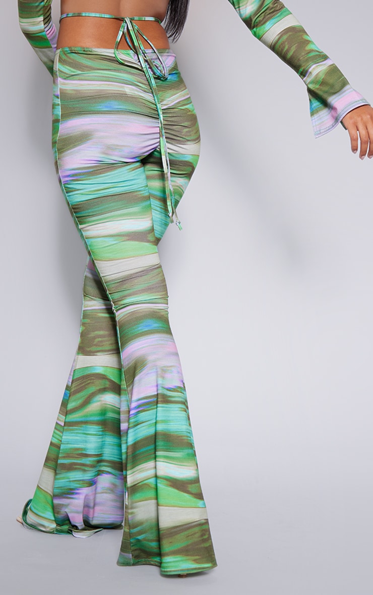 Pantalon flare vert à imprimé à lien noué sur la taille ...